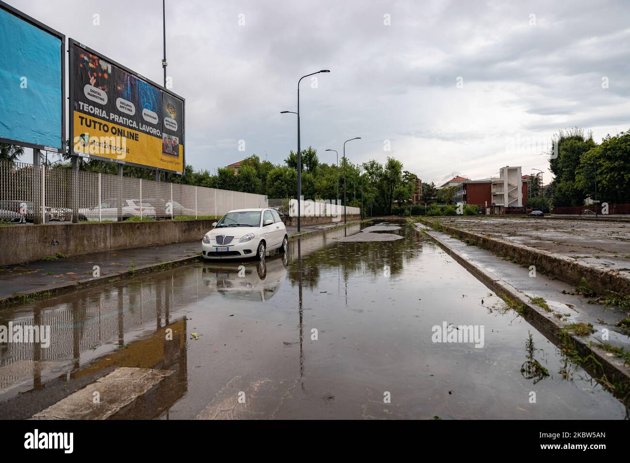 A car in high water during storm and flooding of the Seveso river on ...