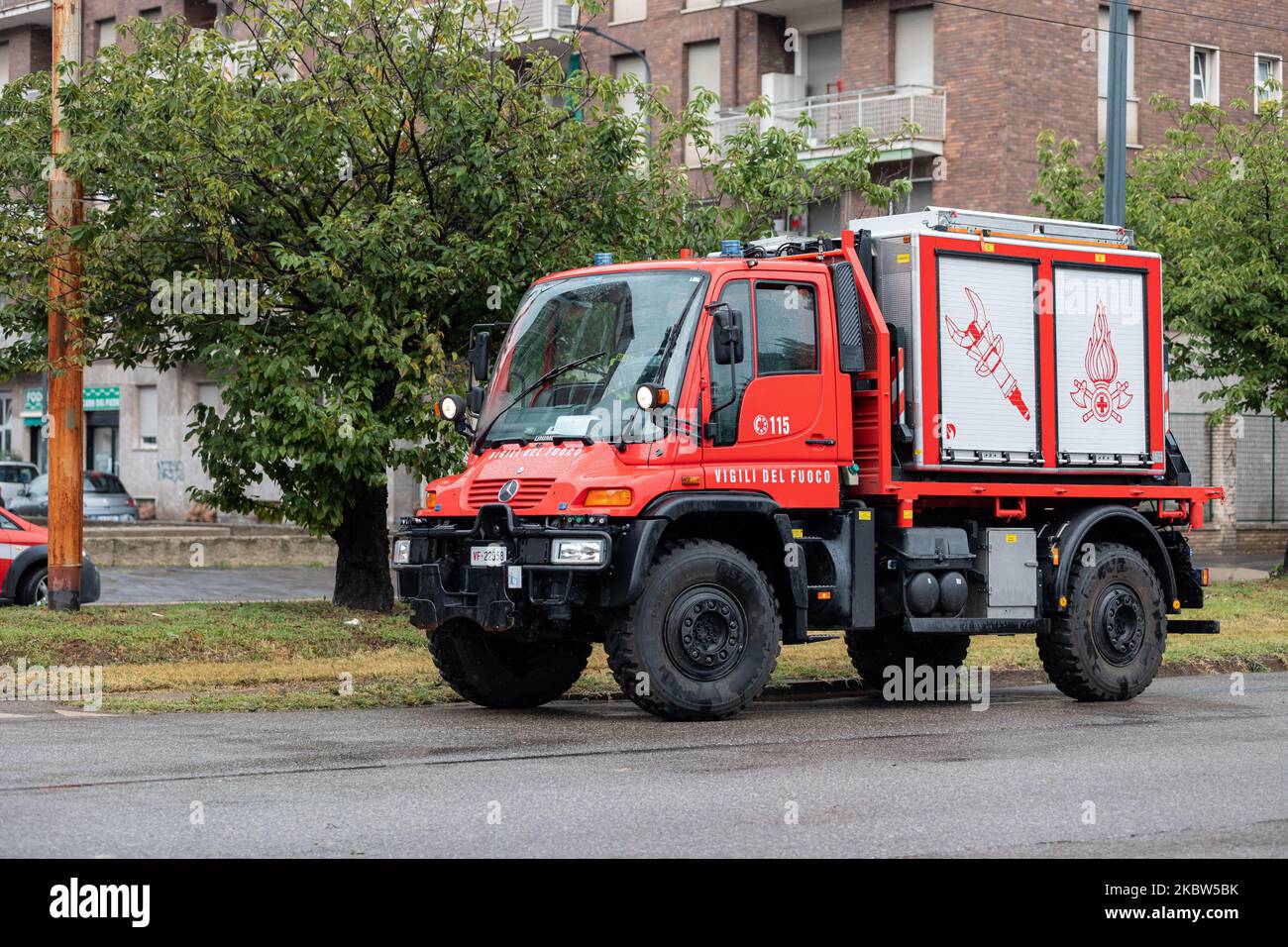 Firemen rescue vehicles during storm and flooding of the Seveso river ...