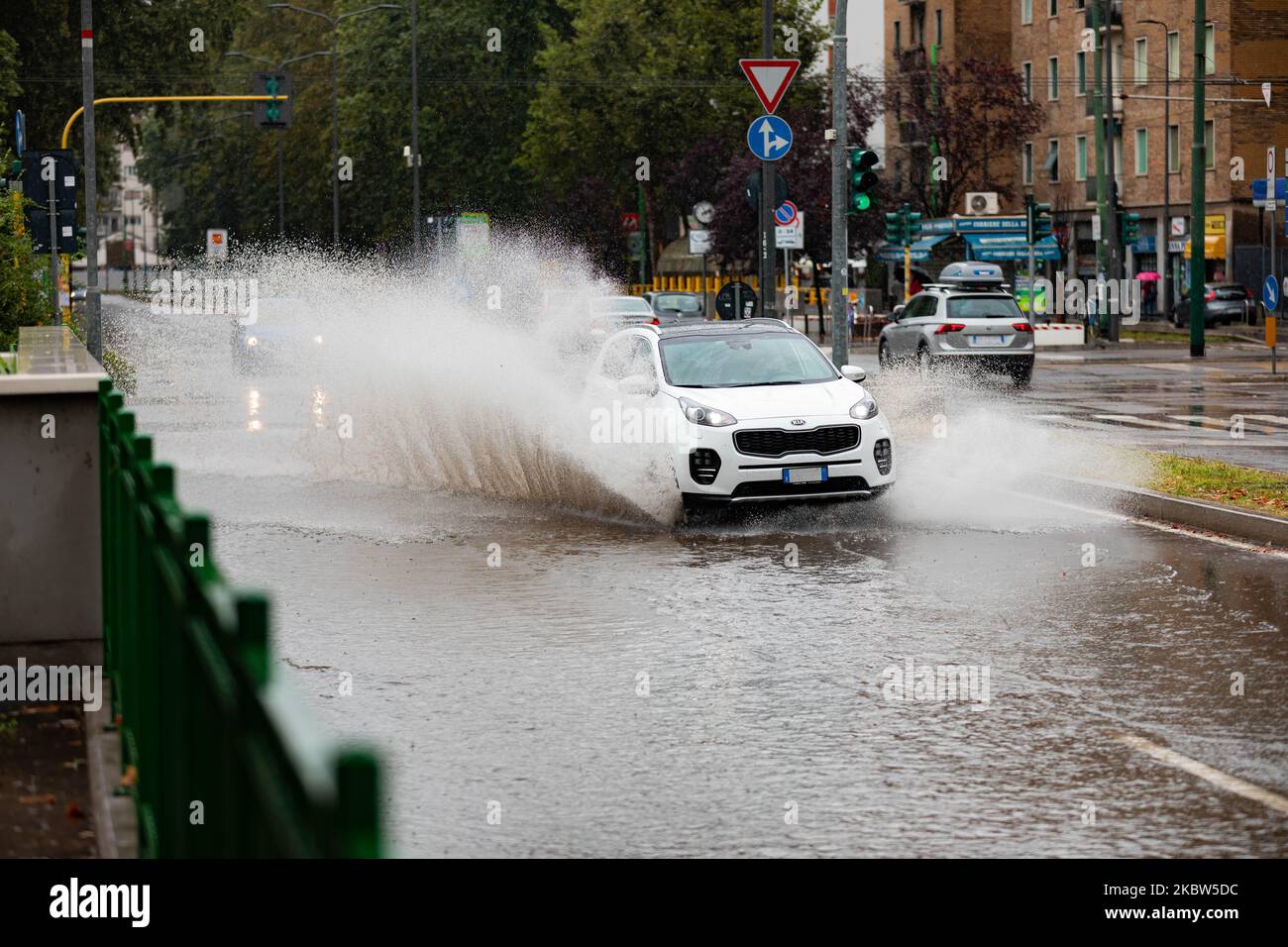 A car in high water during storm and flooding of the Seveso river on ...