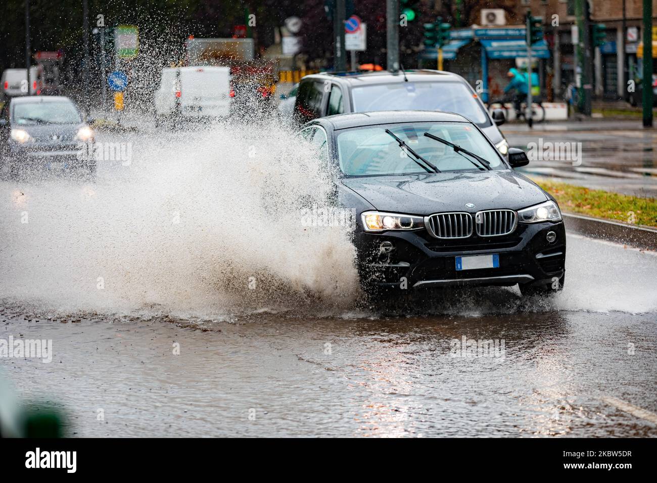 A car in high water during storm and flooding of the Seveso river on ...