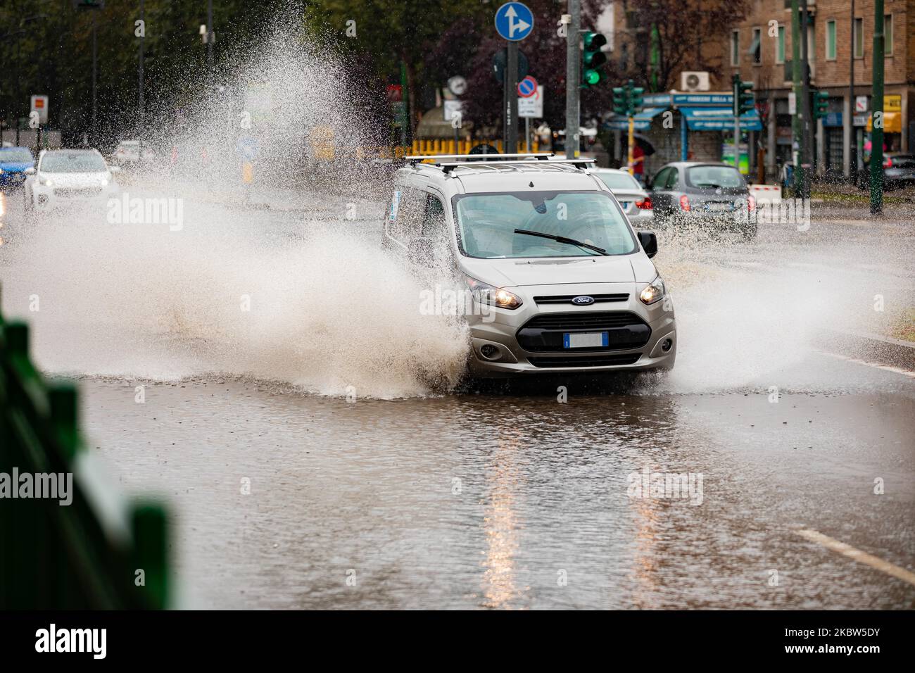 A car in high water during storm and flooding of the Seveso river on ...
