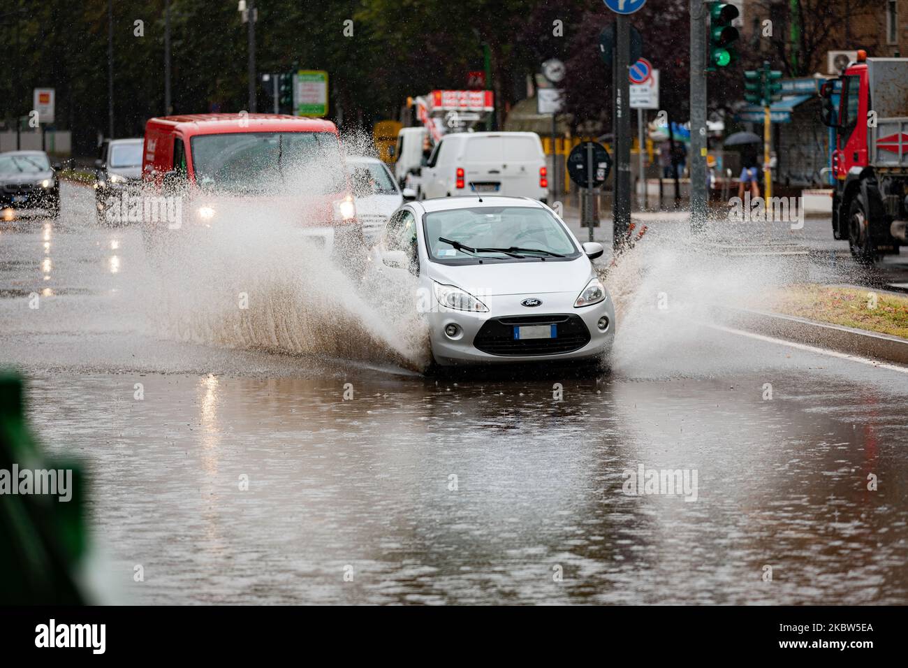 A car in high water during storm and flooding of the Seveso river on ...