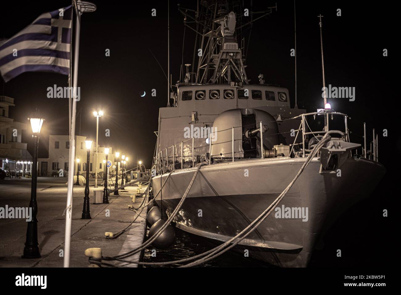 A Greek military ship stationed in the port of Katapola on the Greek ...
