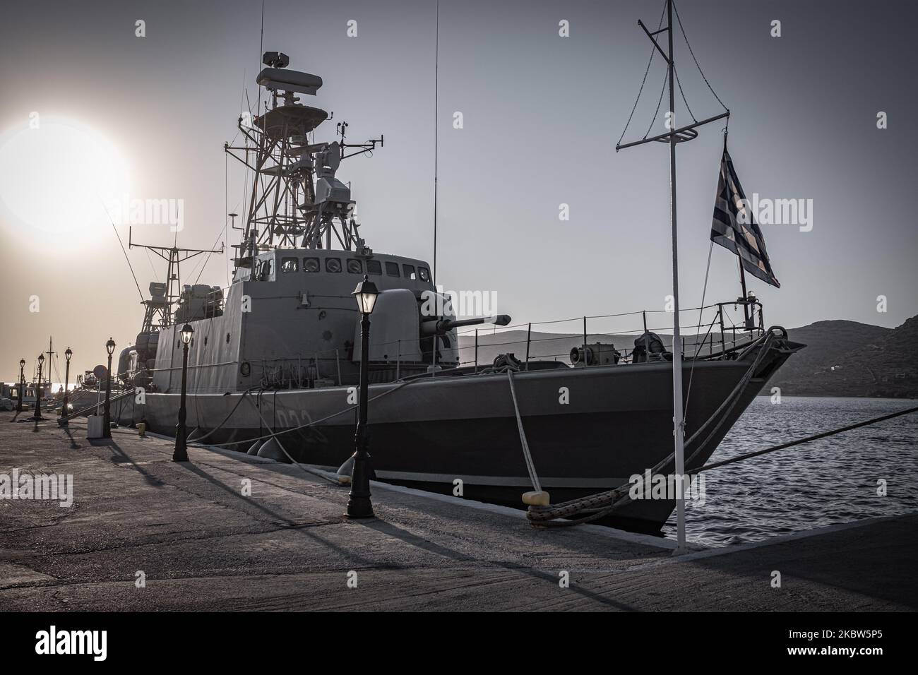 A Greek military ship stationed in the port of Katapola on the Greek ...