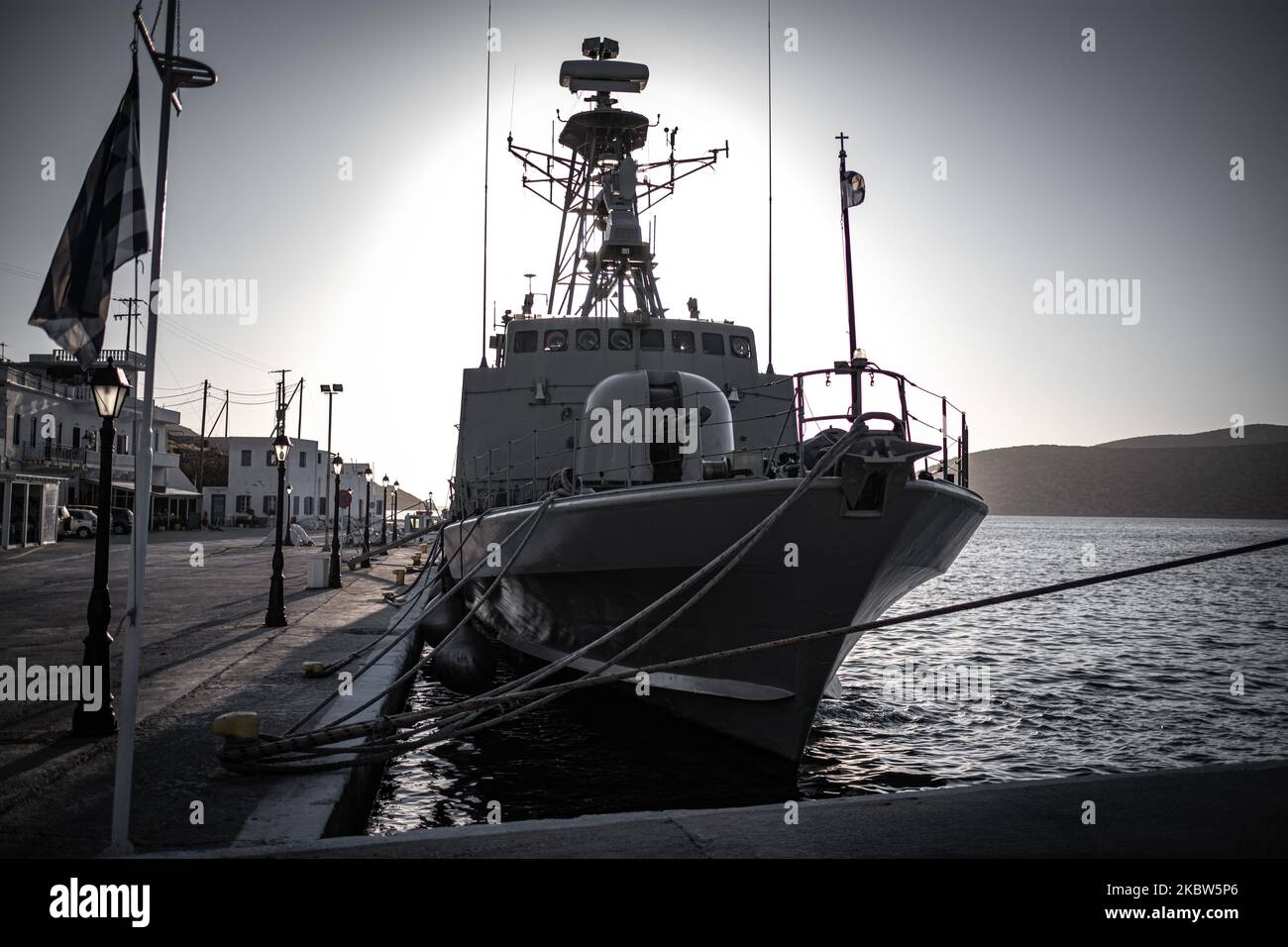 A Greek military ship stationed in the port of Katapola on the Greek ...