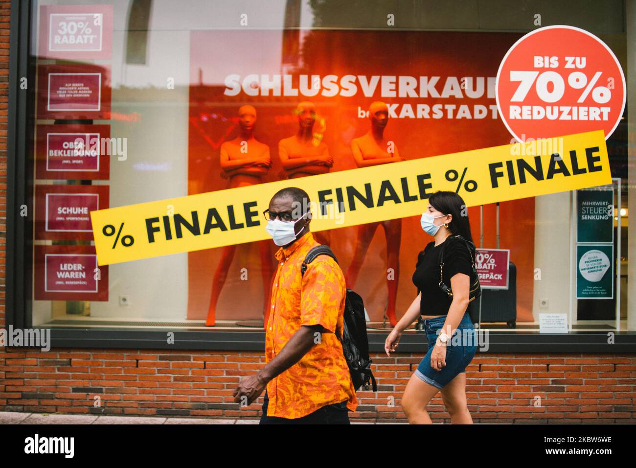 people walks pass the Karstadt department store as the final closing ...