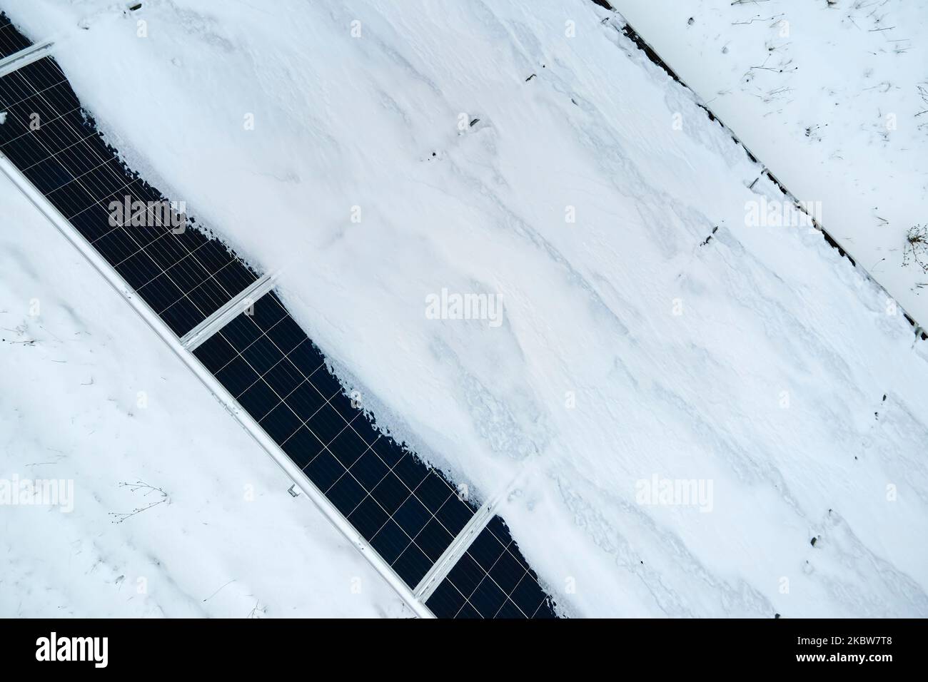 Aerial view of electrical power plant with solar panels covered with ...