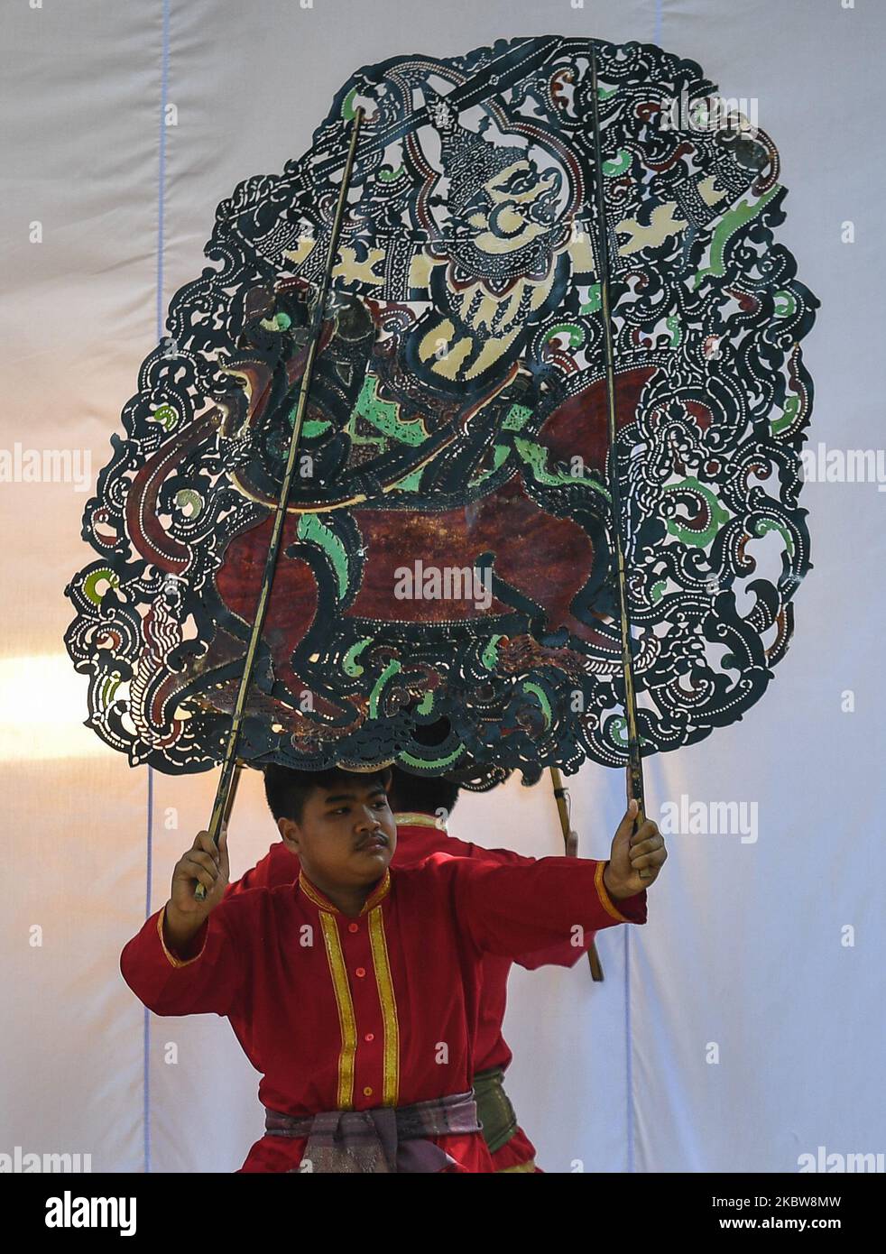 An actor’s movements with a Nang Yai shadow puppet while performing the ...