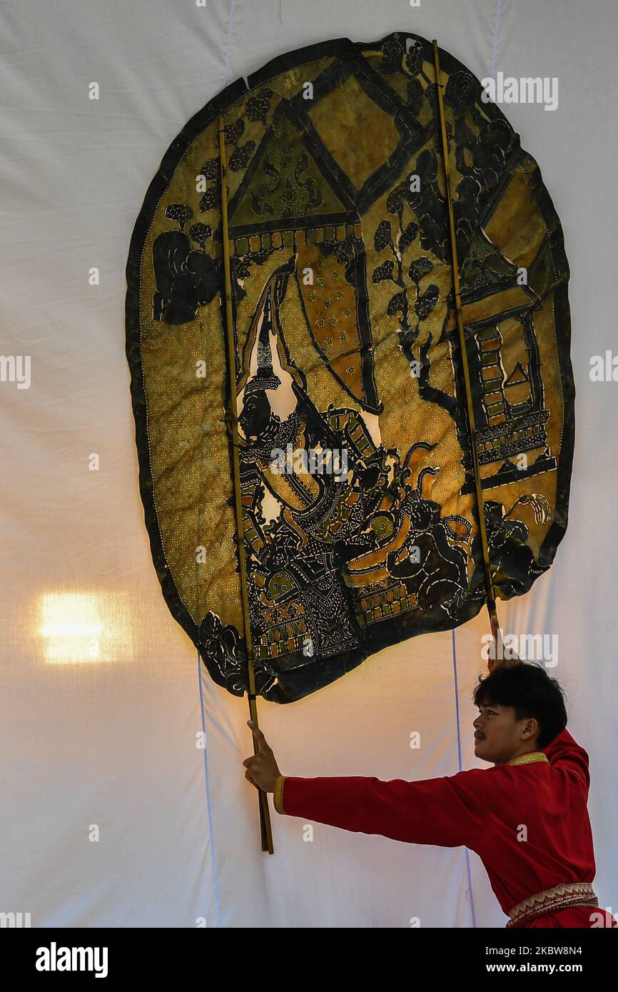 An actor’s movements with a Nang Yai shadow puppet while performing the ...