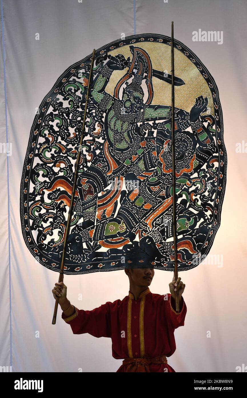 An actor’s movements with a Nang Yai shadow puppet while performing the ...