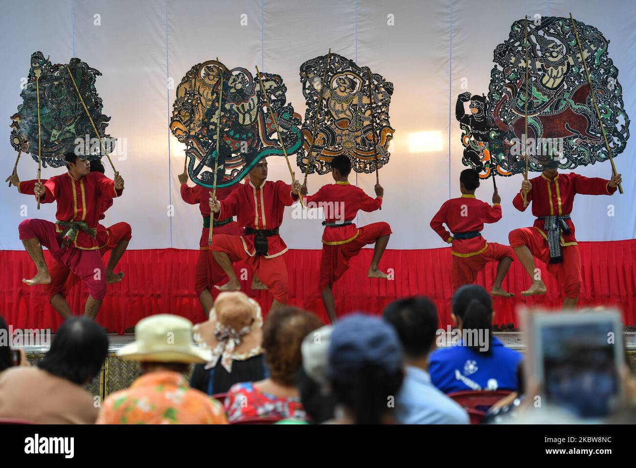Actors’s movements with Nang Yai shadow puppets while performing in ...