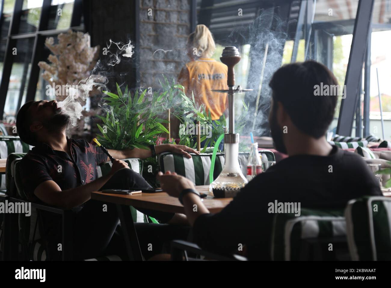 A Turkish man smokes a shisha in a hookah bar in Esenyurt, Istanbul ...