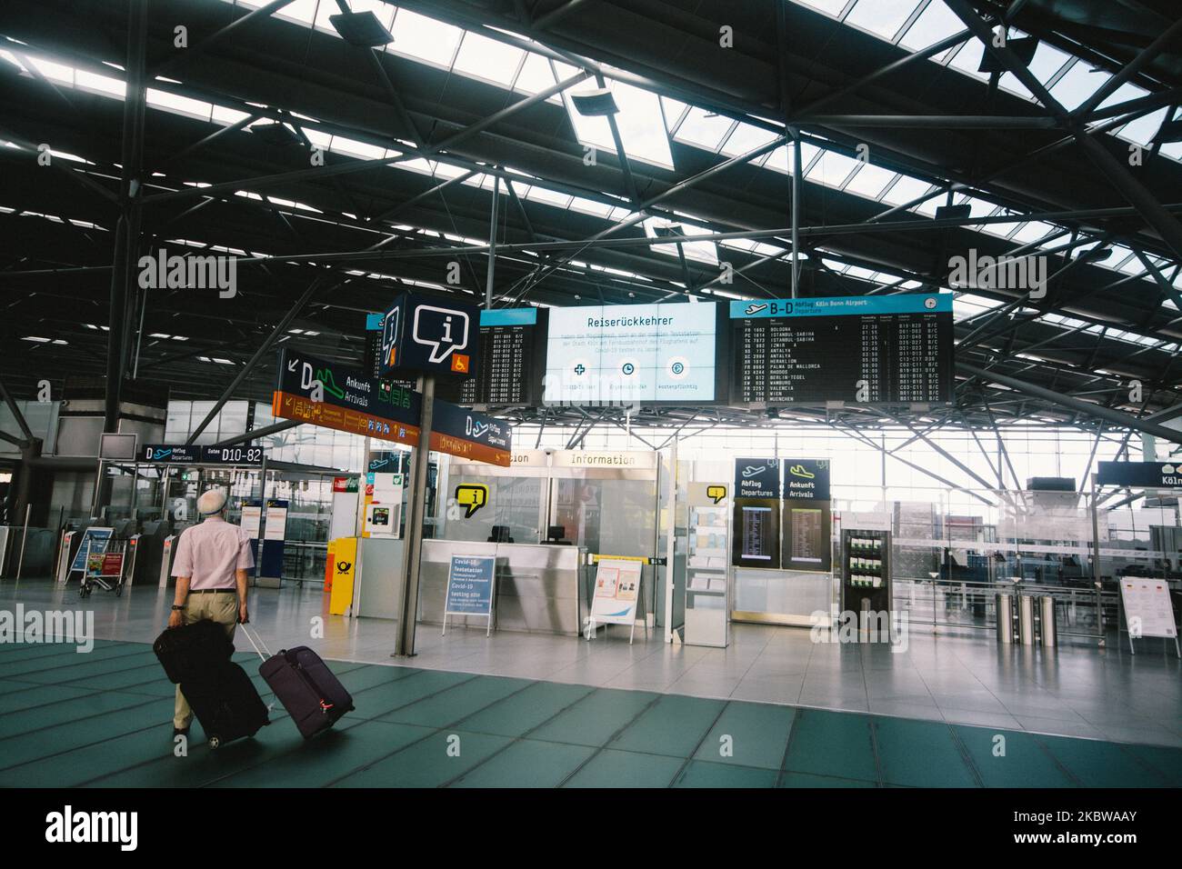 a man look up a billboard which inform people testing center available ...