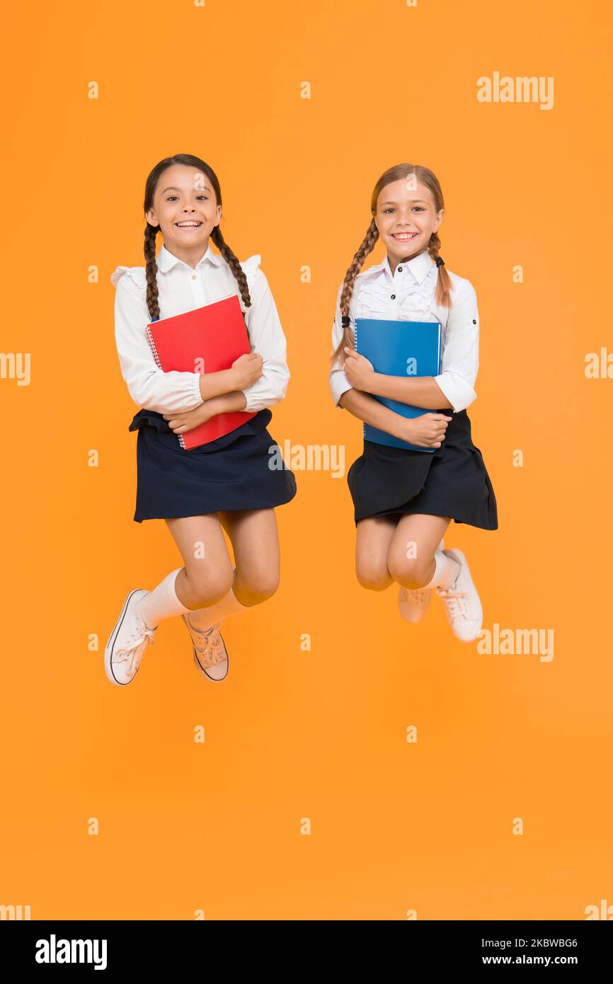 Cheerful school girls. Back to school. Point out positive aspects ...