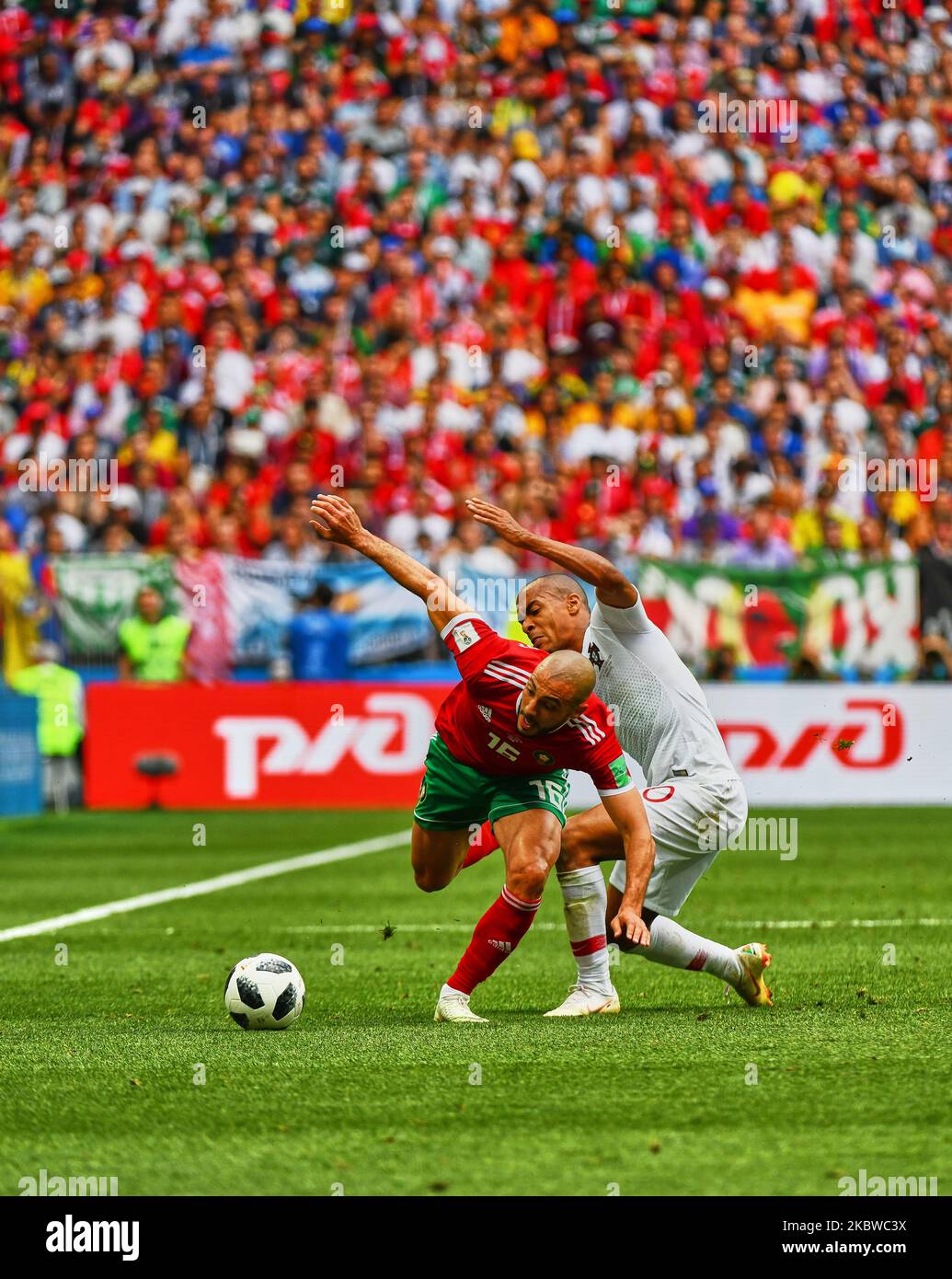 Noureddine Amrabat of Morocco and Joao Mario of Portugal fighting for ...