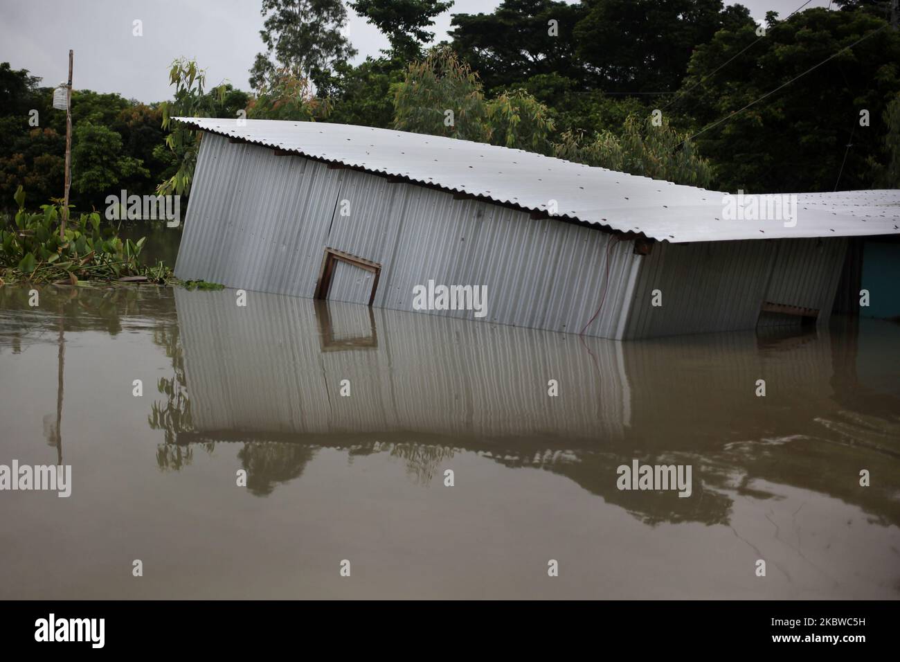 Houses are seen flooded as flood situation worsens at Mawa area in ...