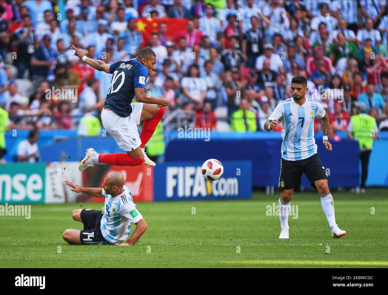 Kylian Mbappe of France jumping over Javier Mascherano of Argentina ...