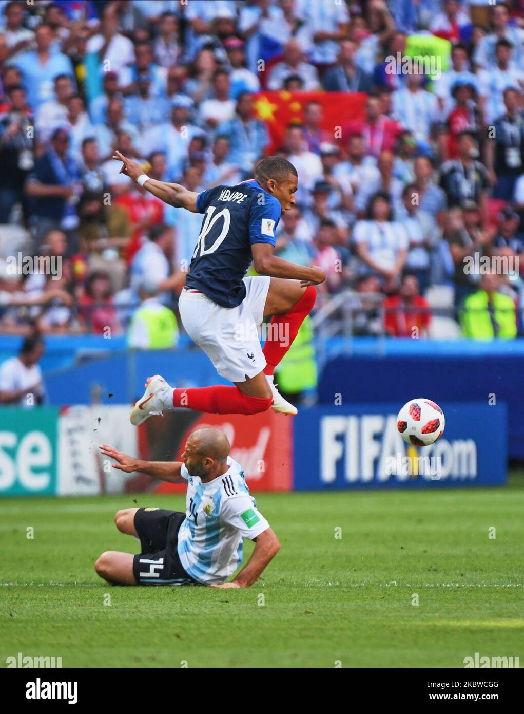 Kylian Mbappe of France jumping over Javier Mascherano of Argentina ...
