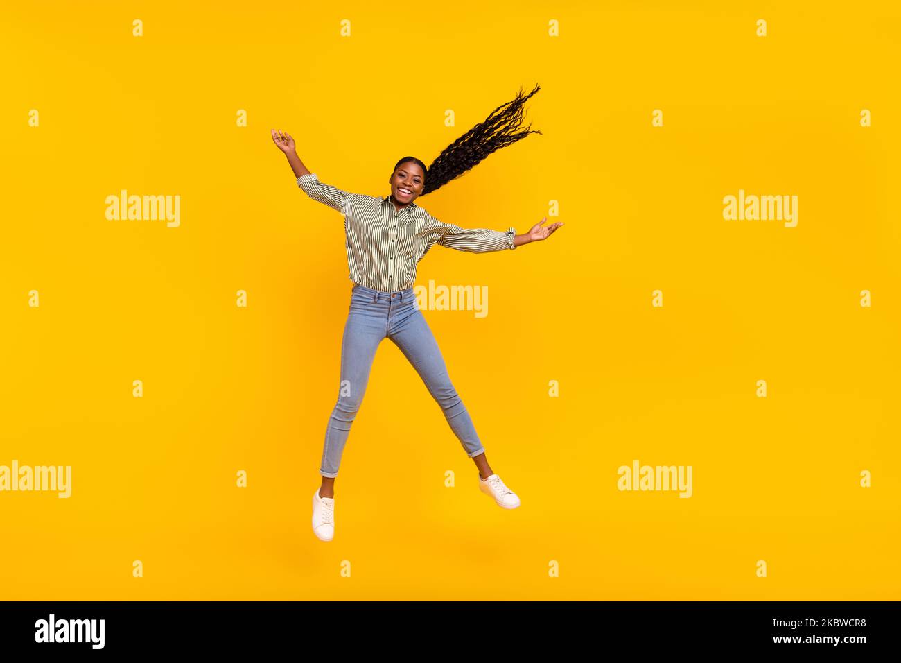 Full size portrait of childish satisfied lady fly jumping toothy smile ...