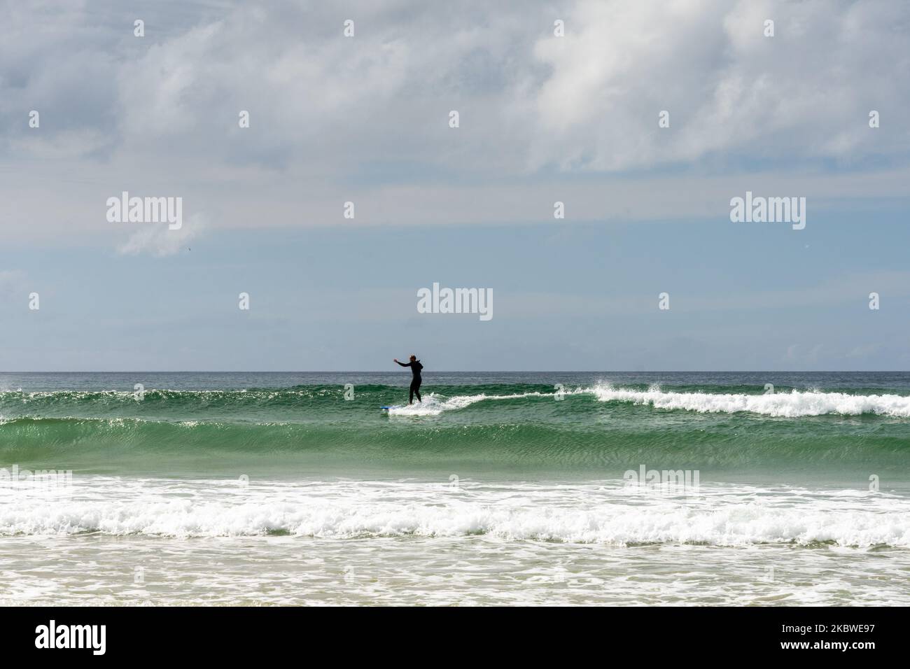 Newquay, United Kingdom - 4 Spetember, 2022: surfer catching a wave at ...