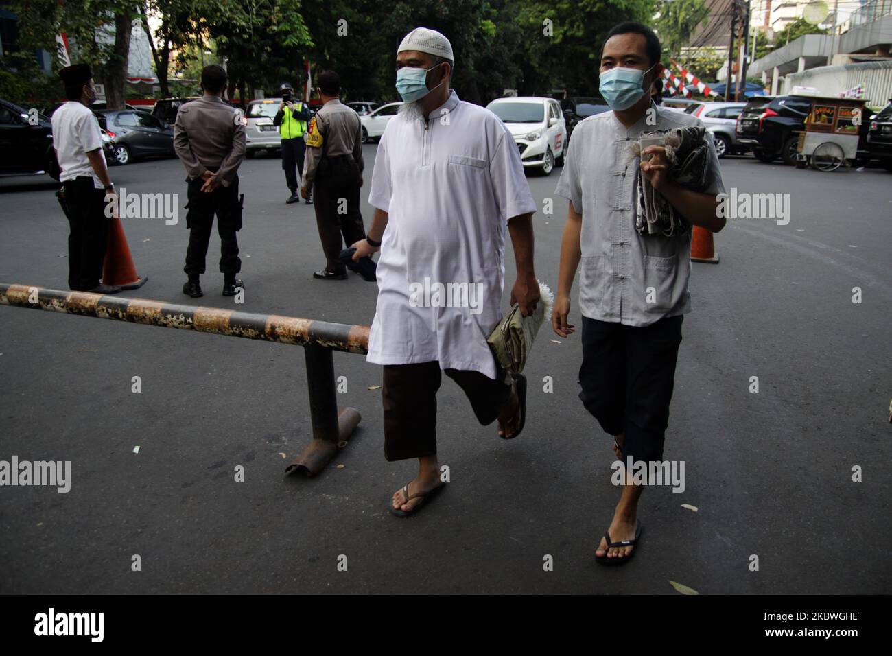 Indonesian muslims wearing protective face mask as one of the new ...