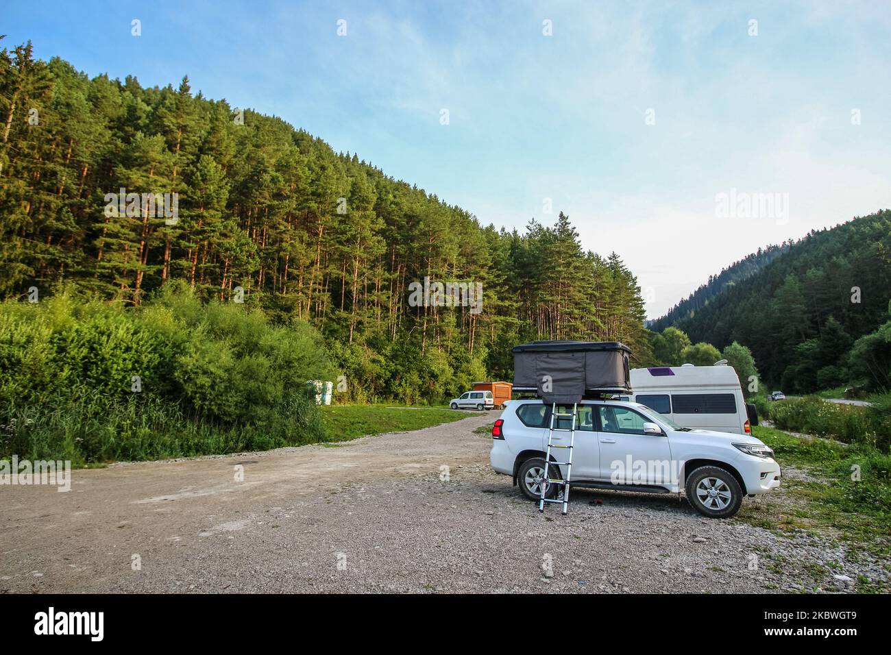 People camping in a 4x4 Toyota Landcriuser with a roof tent is seen in ...