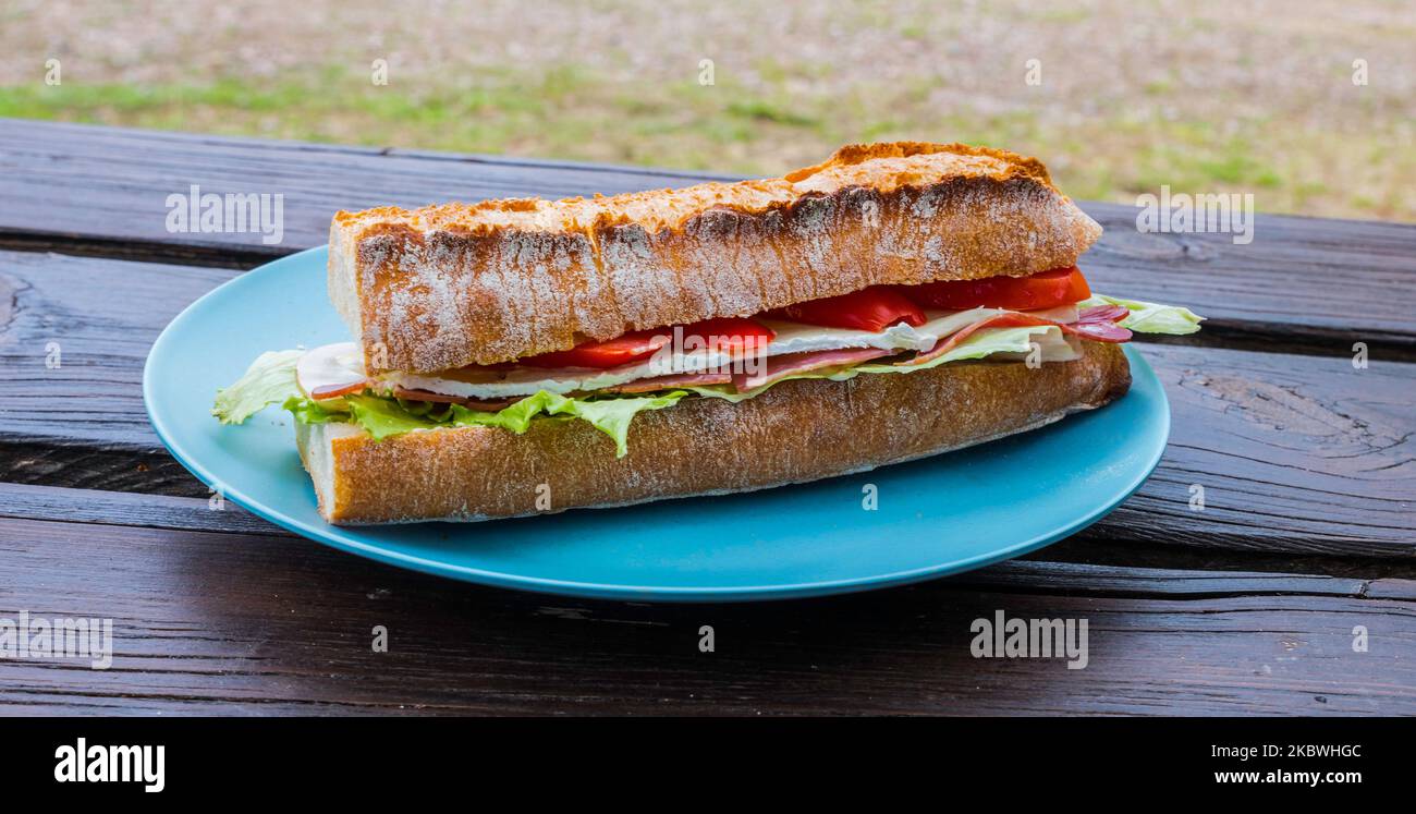 a lunch in france with a brie baguette Stock Photo - Alamy