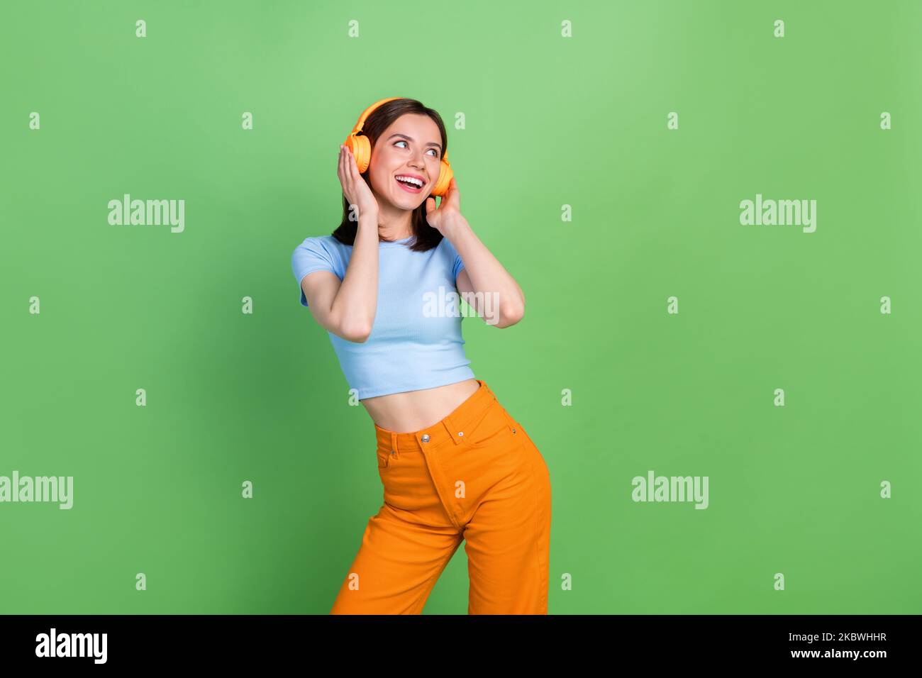 Photo of cheerful adorable lady toothy smile touch headphones look ...