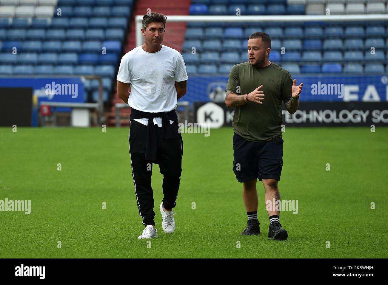Harry Kewell with Oldham Head Groundsman Paul Flynn on the Boundary ...