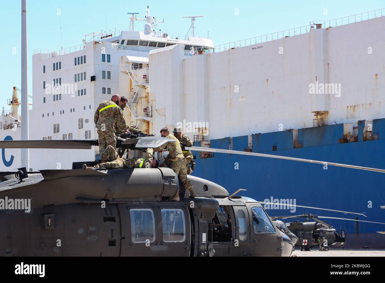 United States of America Army Troops assembly and fix their helicopters ...