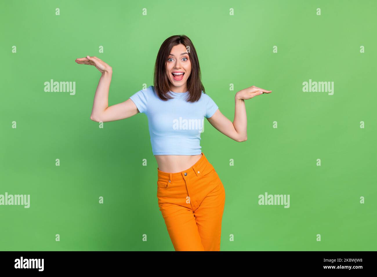 Photo of pretty positive person arms hold weighing empty space ...