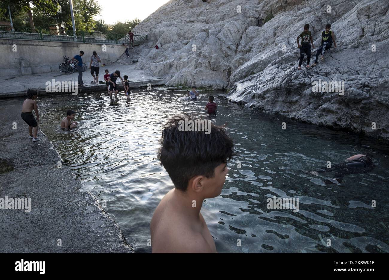 Iranian boys swim in the Cheshmeh-Ali natural fountain in Shahr-e-Rey ...