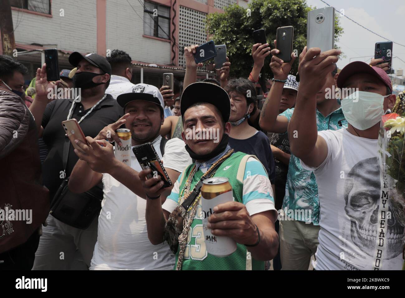 A group of young people outside the Santa Muerte temple, located in ...