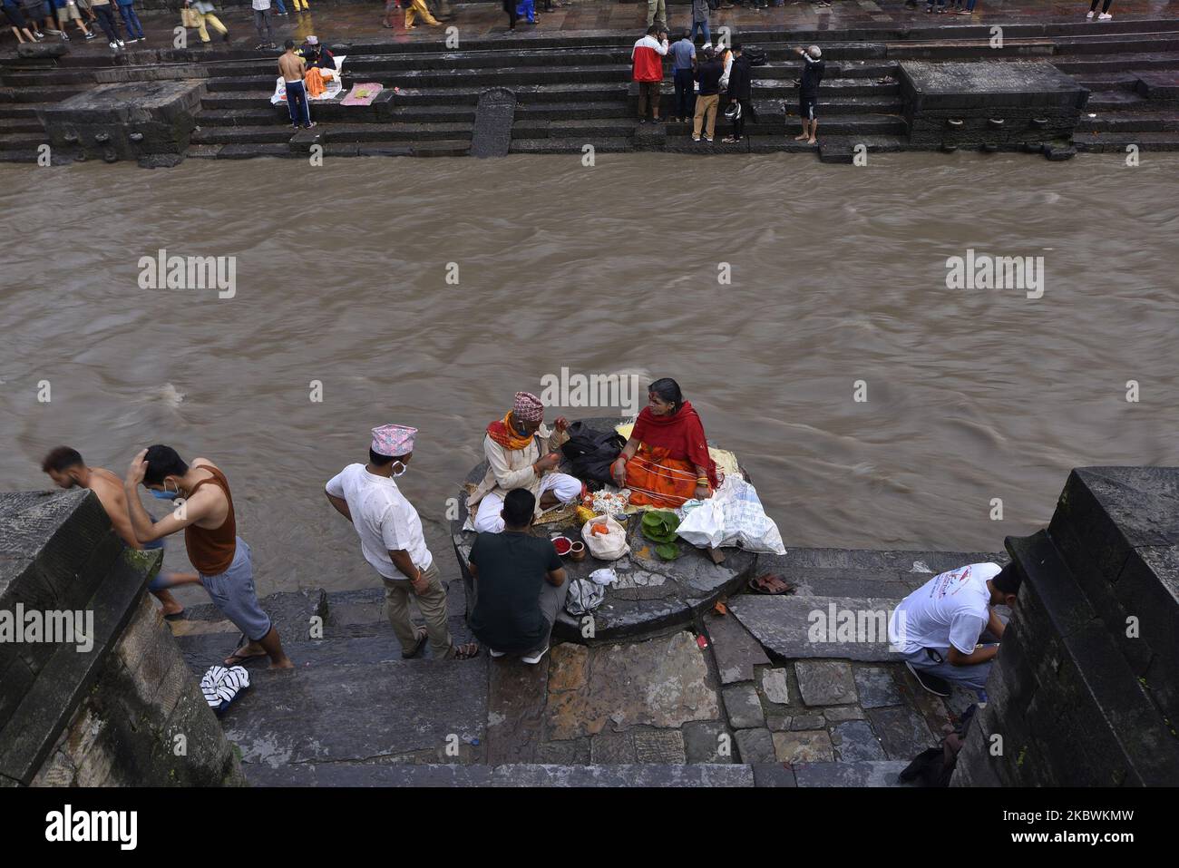 A Nepalese Priest offering rituals during Janai Purnima festival or ...