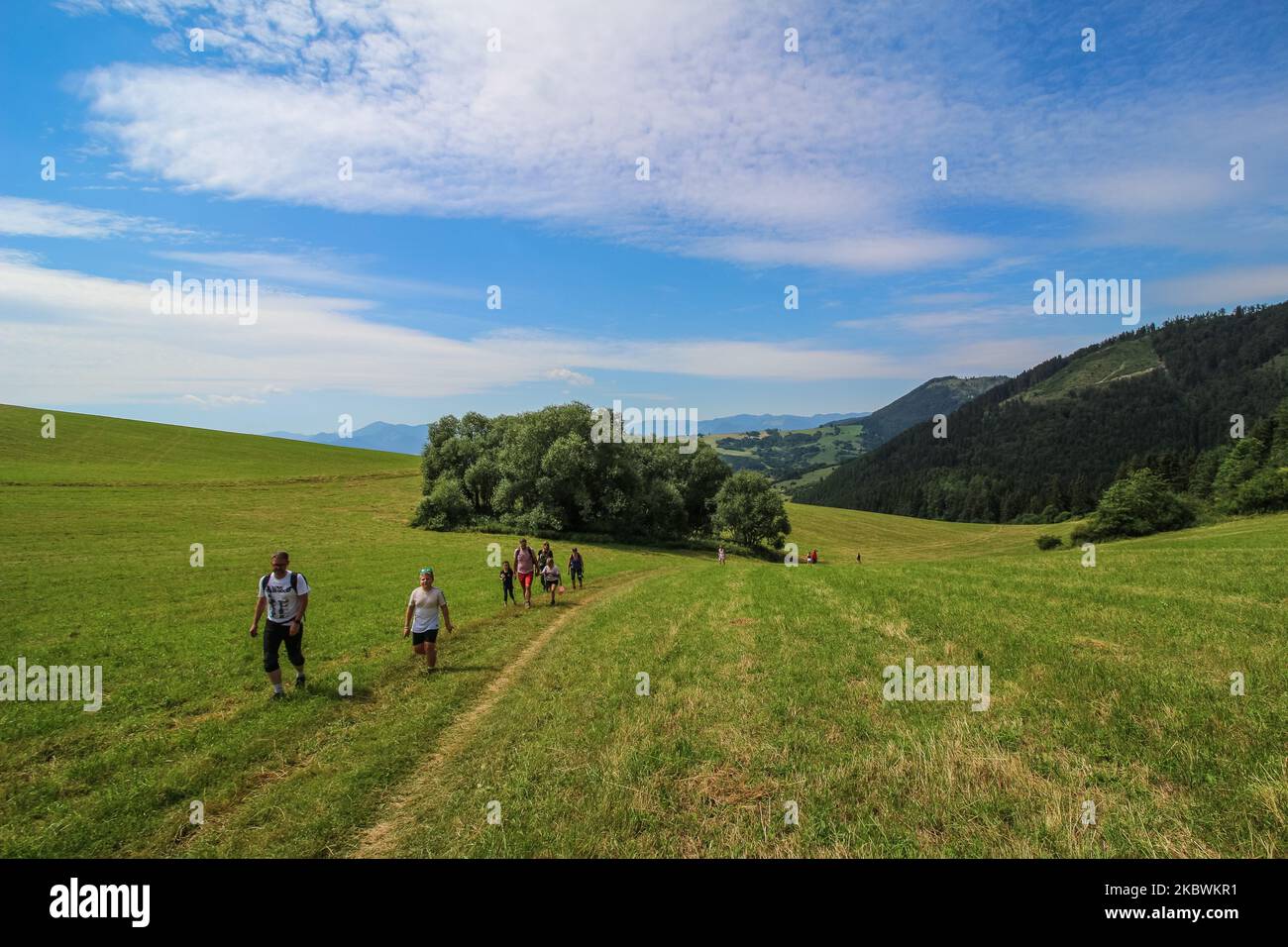 People hiking are seen in Choc Hills, Tatra-Fatra Mountains area, near ...
