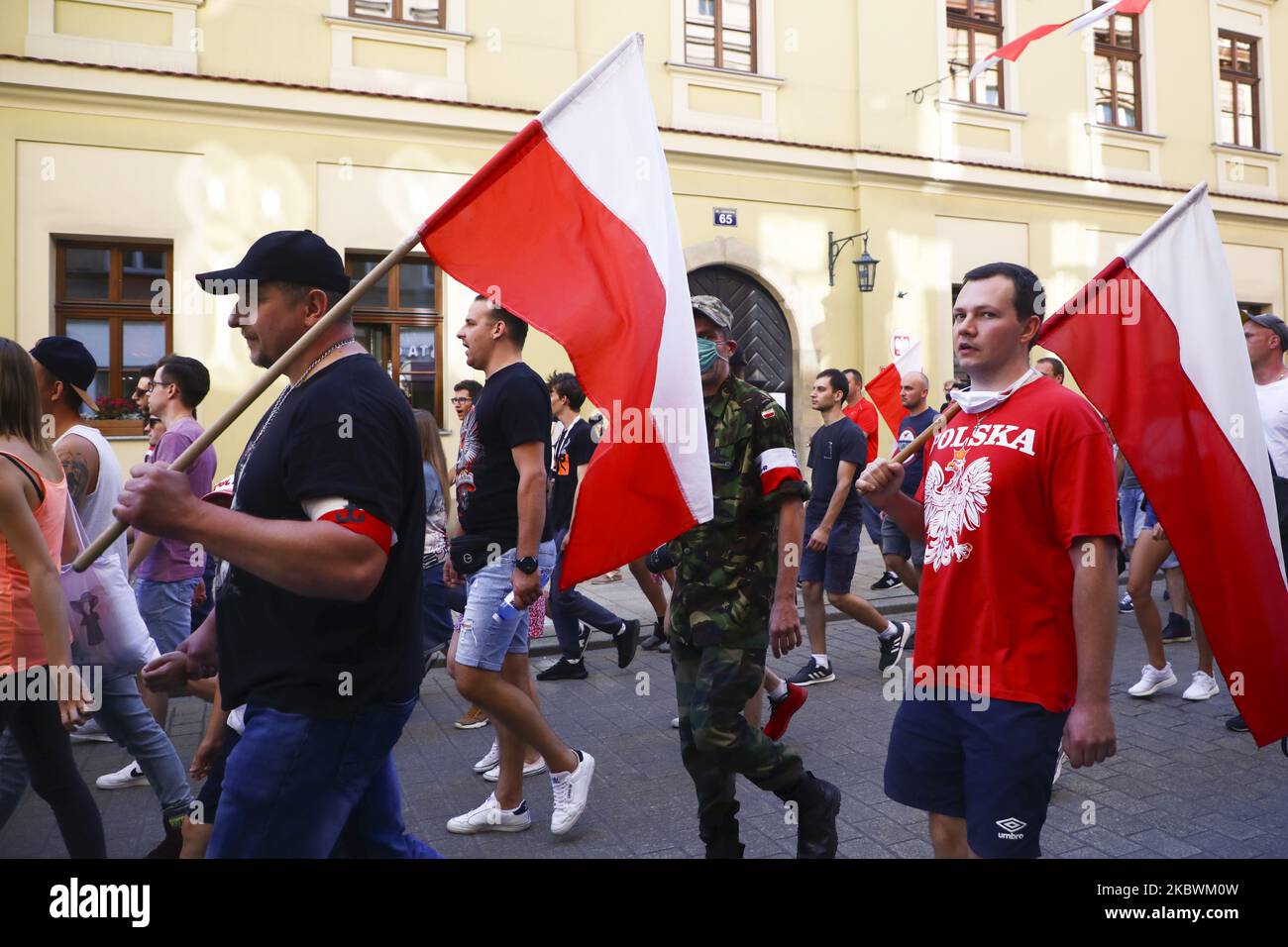 People with national flags take part in far-right march during the 76th ...