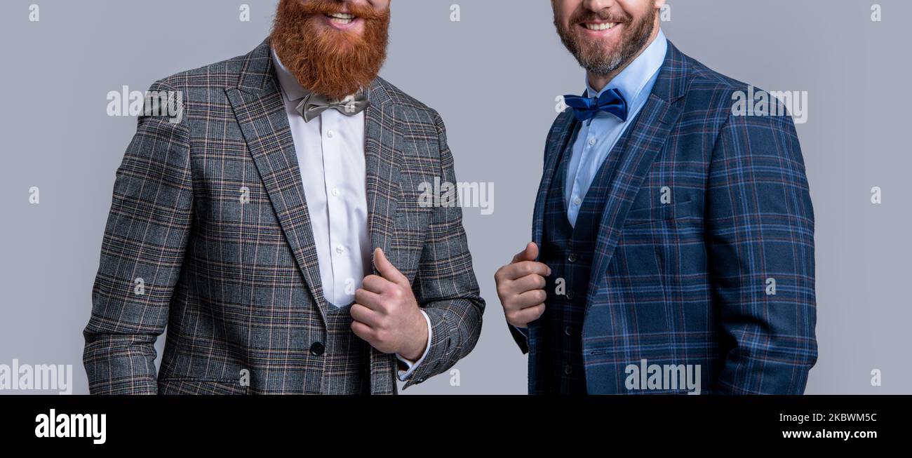 cropped view studio shot of men wearing tux. elegant men in formal tux ...