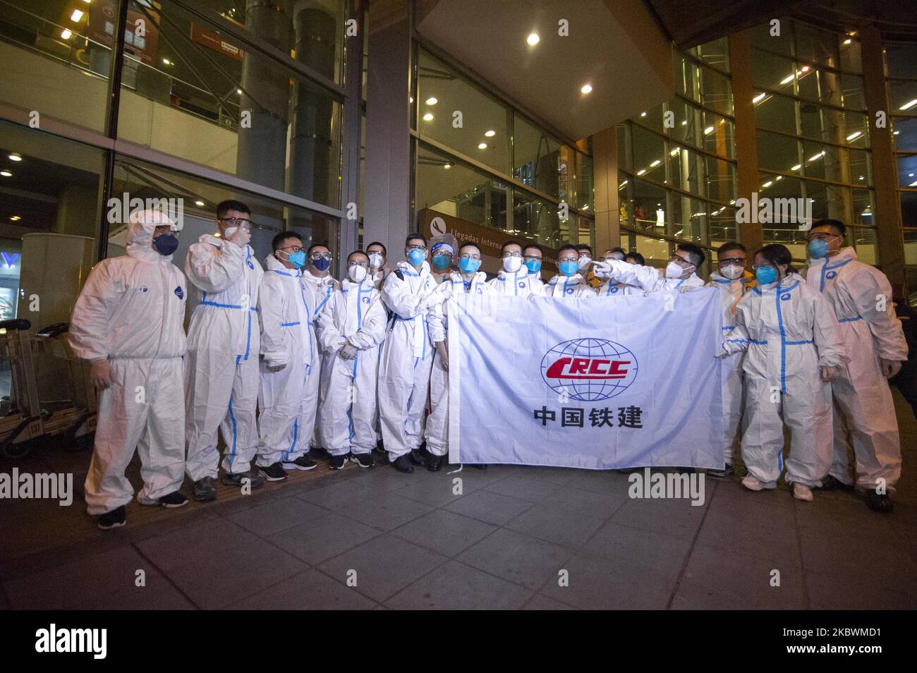 Chinese engineers arrive using protective biohazard suits to prevent ...