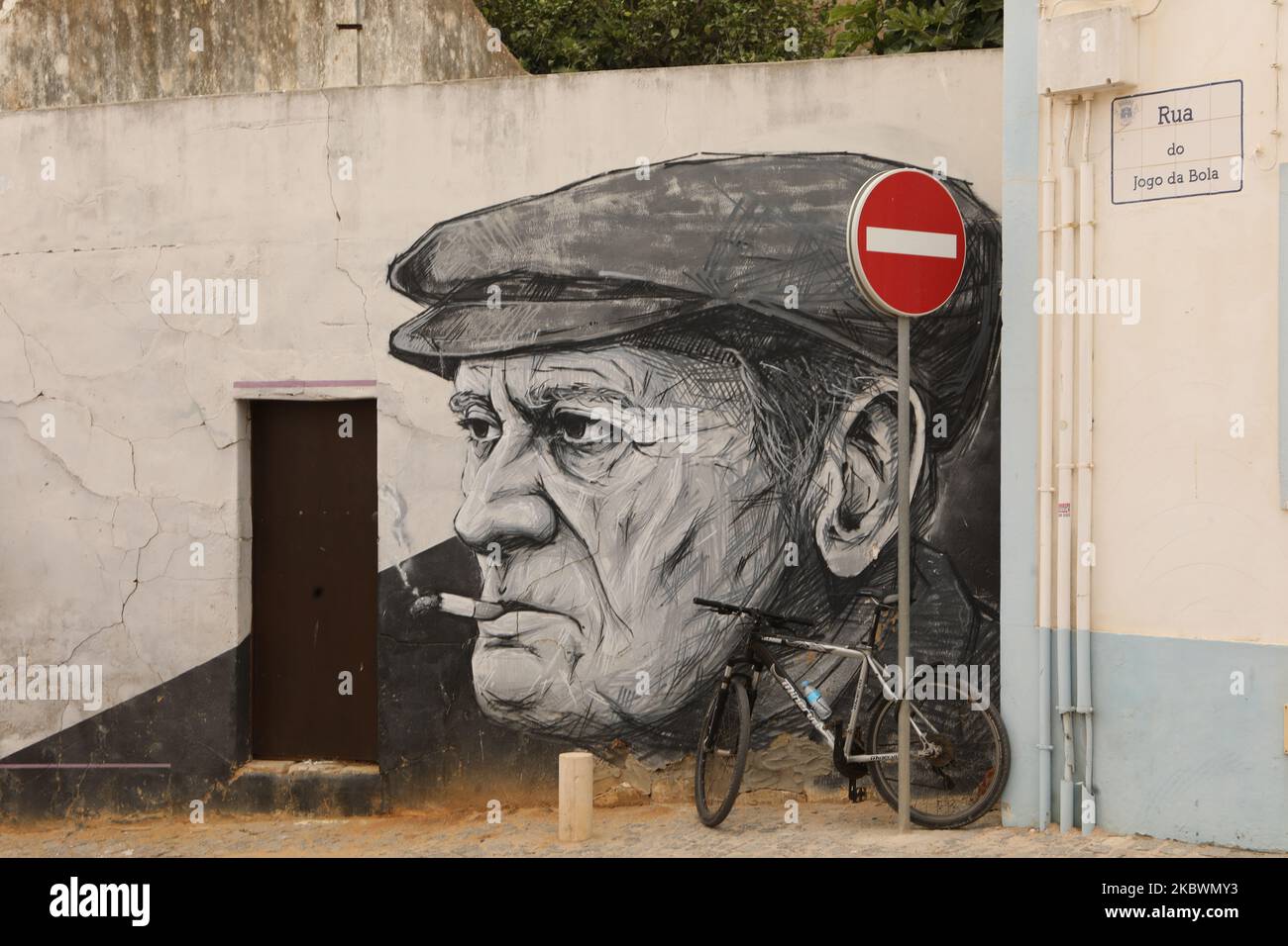 The smoking man mural, Lagos, Algarve, Portugal Stock Photo - Alamy