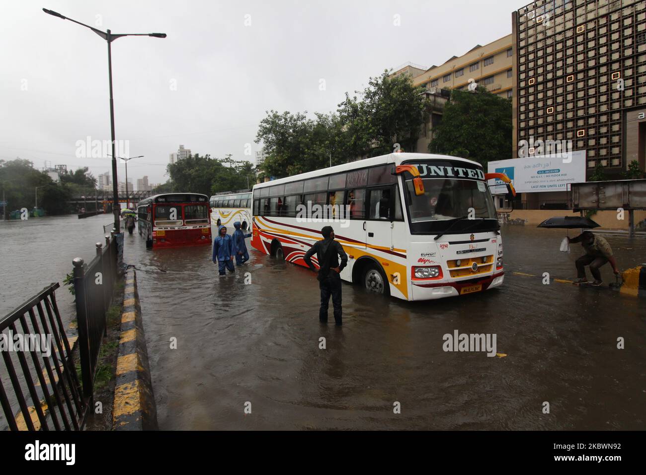 Buses are seen submerged on a flooded road during heavy rains in Mumbai ...