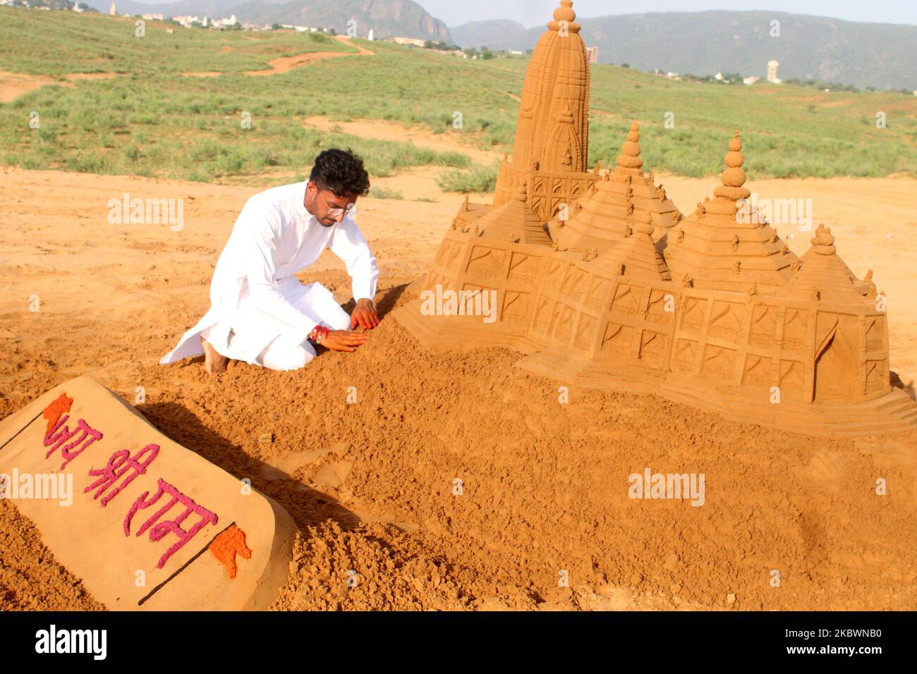 Indian Sand artist Ajay Rawat gives a final touch his sculpture on 'Ram ...