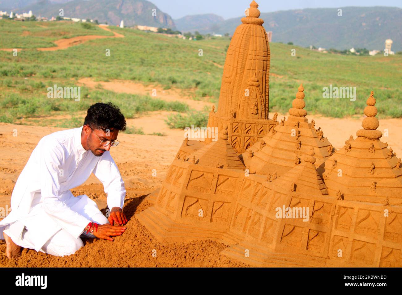 Indian Sand artist Ajay Rawat gives a final touch his sculpture on 'Ram ...
