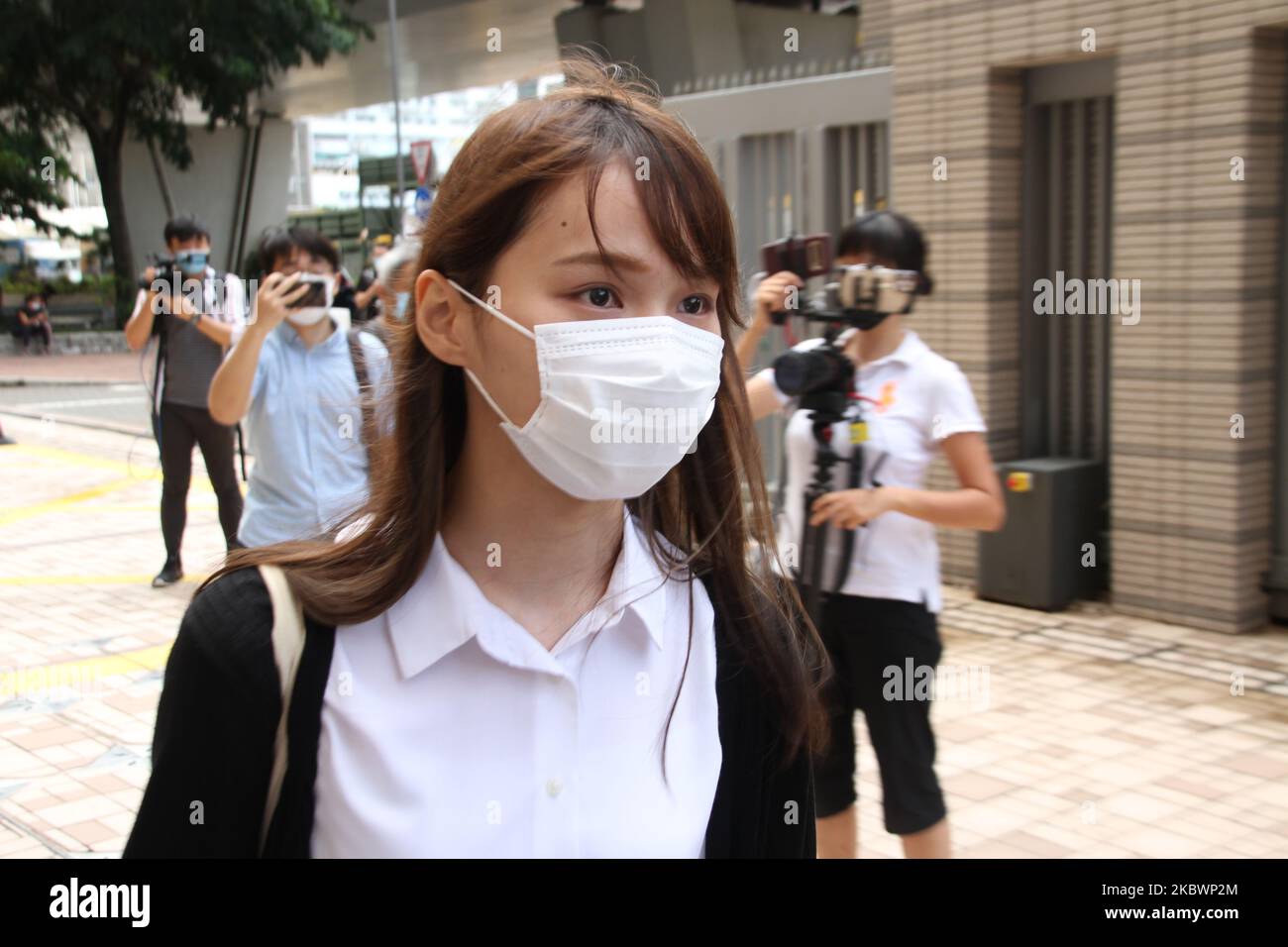 Pro-democracy activist Agnes Chow enters West Kowloon Courthouse facing ...
