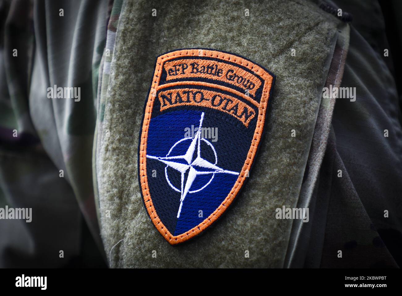 NATO - OTAN badge is seen on a uniform of American soldier who attends ...