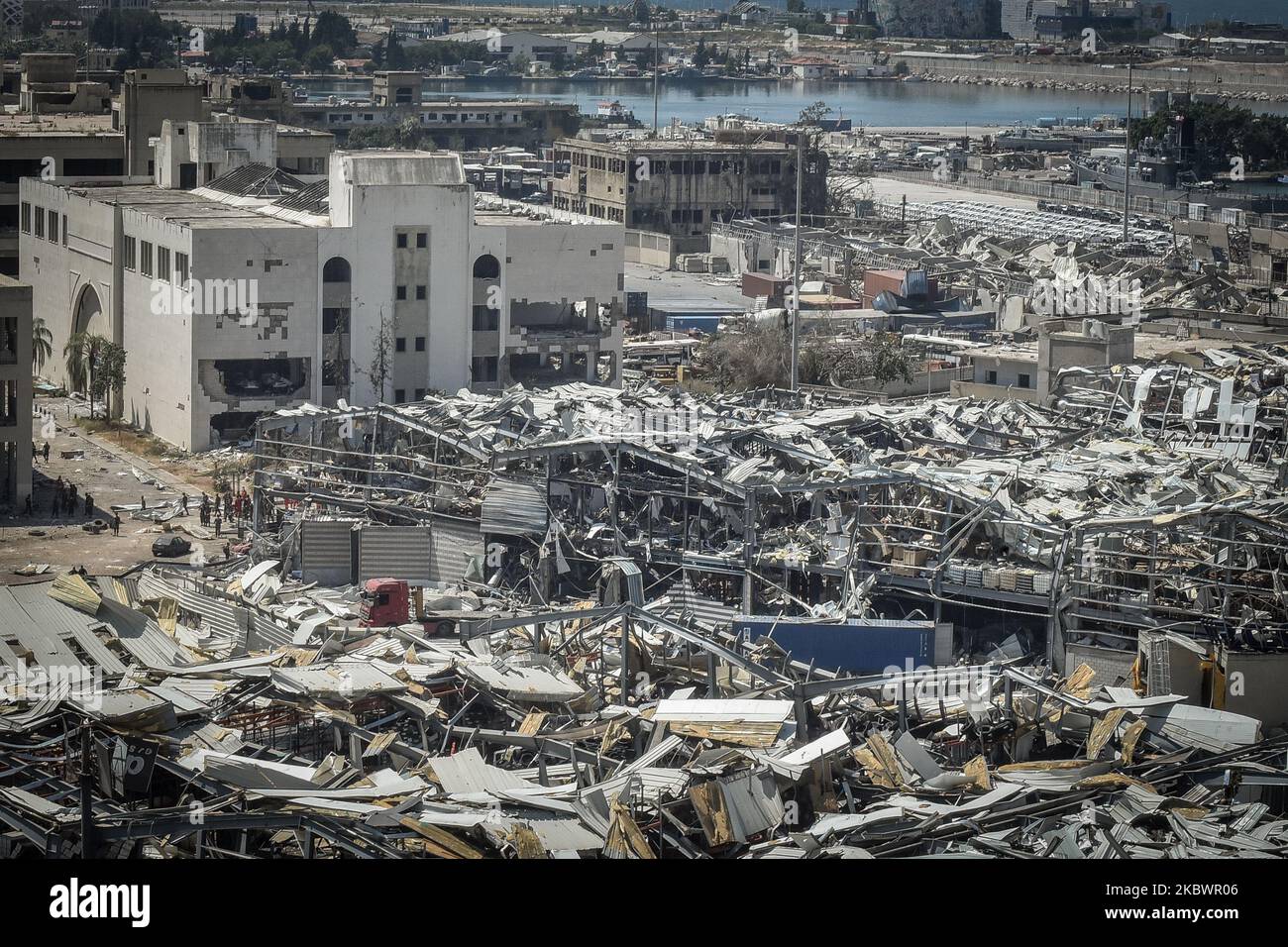 Damaged buildings are seen the day after a massive explosion at the ...