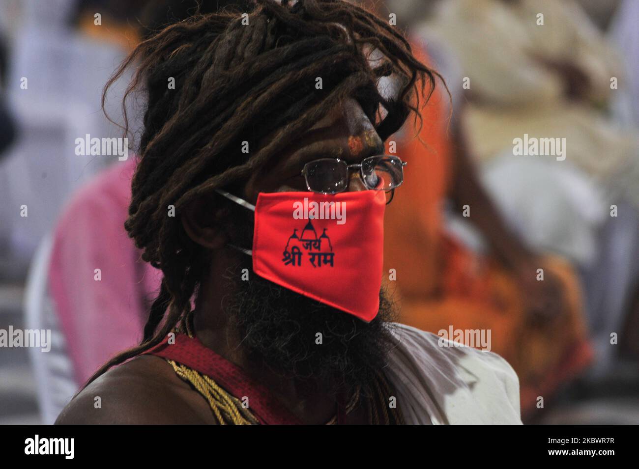 A saint wearing protective mask watches Ground breaking ceremony hosted ...