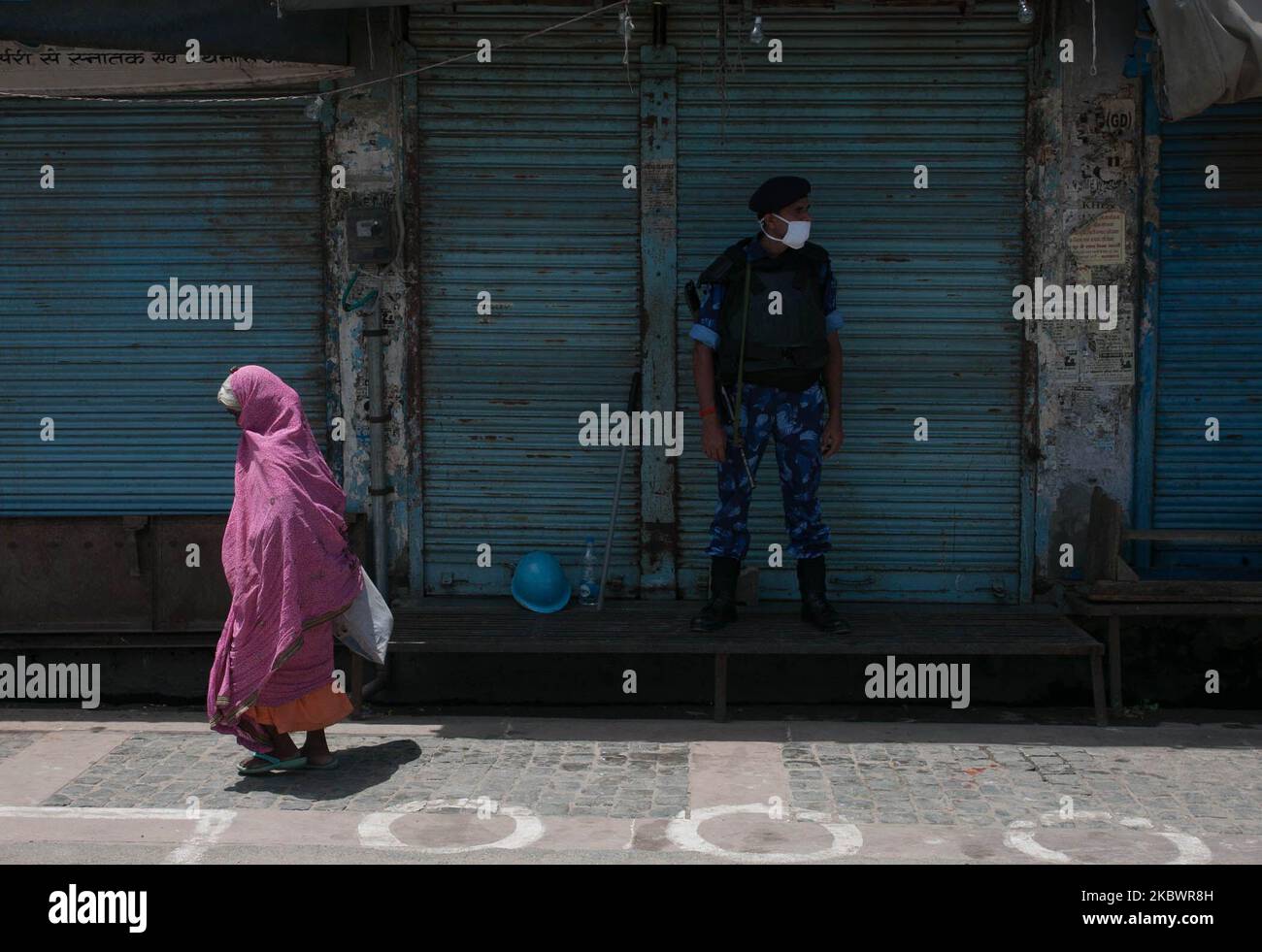 A security personnel guards a street during Ground breaking ceremony ...