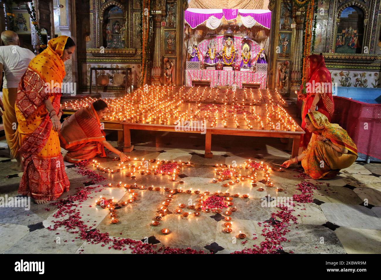 Hindu devotees light earthen lamps at Ramchandra Ji Temple to celebrate ...