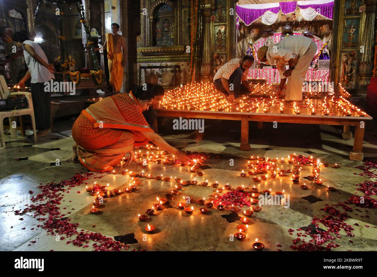 Hindu devotees light earthen lamps at Ramchandra Ji Temple to celebrate ...