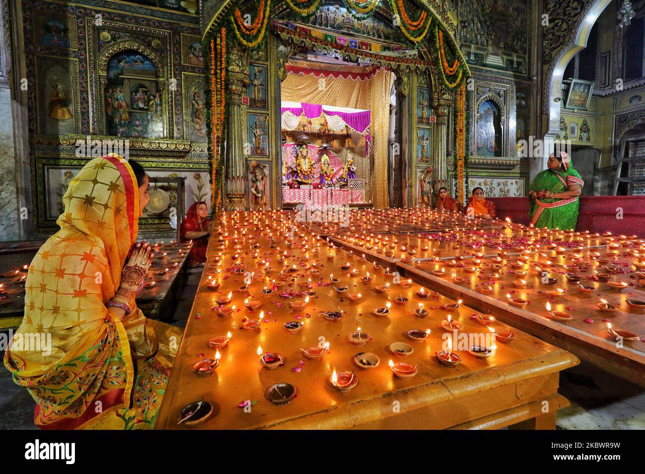 Hindu devotees light earthen lamps at Ramchandra Ji Temple to celebrate ...